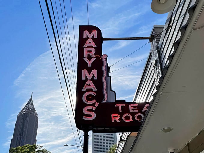 The iconic white brick exterior with burgundy awnings stands as Atlanta's culinary time machine, beckoning hungry souls with its vintage charm.