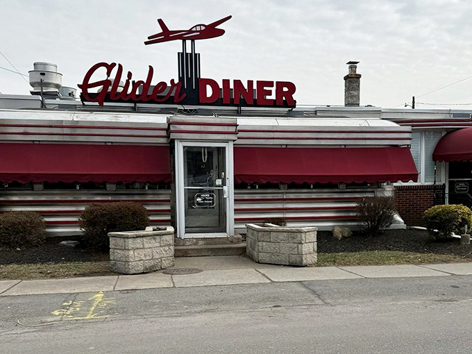 That iconic red glider airplane isn't just decoration—it's a beacon calling hungry travelers home to this Scranton institution where comfort food reigns supreme.
