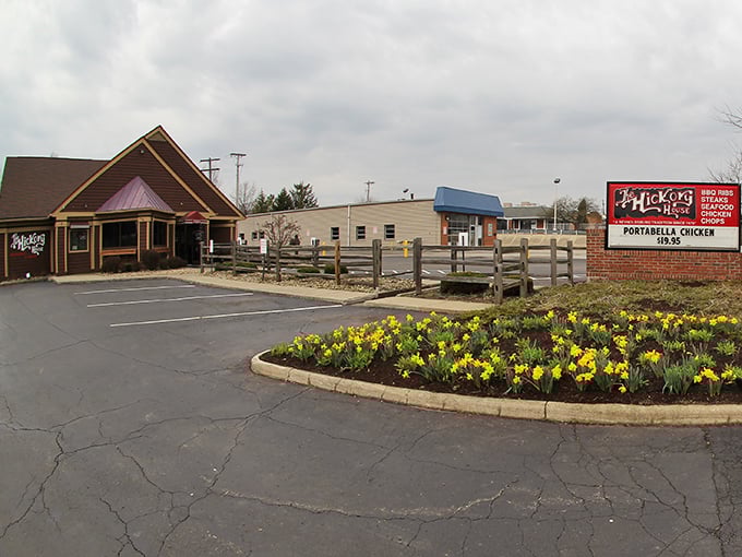 The rustic charm of Hickory House's exterior isn't just inviting—it's practically winking at you to come inside. Those flowers aren't just decoration; they're nature's welcome committee.