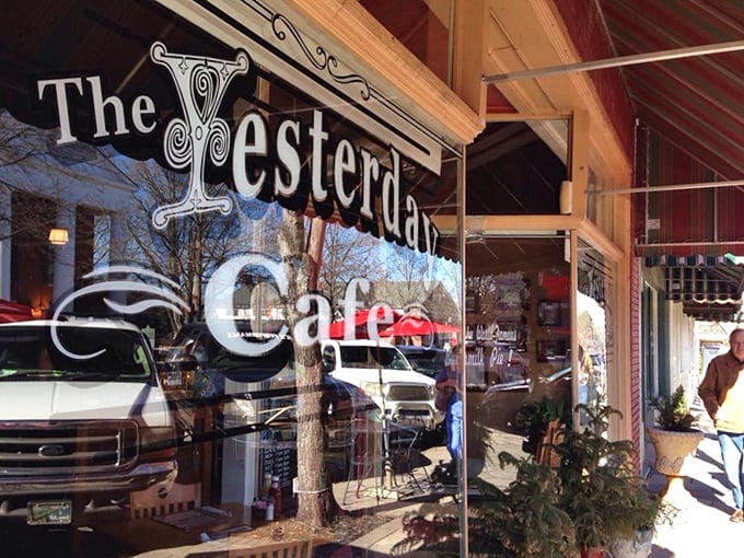 The classic red brick and striped awning exterior isn't just charming—it's the gateway to buttermilk pie paradise. Small-town America at its most delicious.