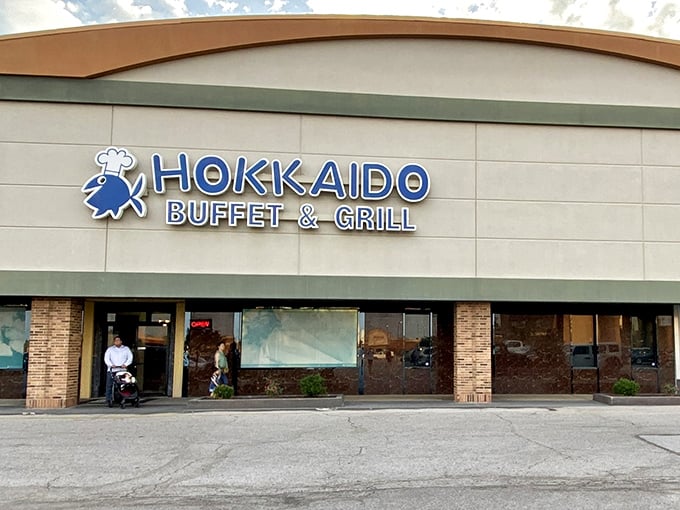 The blue fish chef logo welcomes hungry patrons like a culinary lighthouse guiding ships to shore. Hokkaido's unassuming exterior hides treasure within.