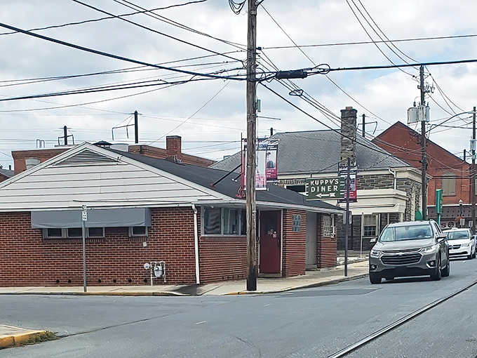 The cherry-red exterior of Kuppy's Diner isn't trying to be retro—it's the real deal, serving Middletown since 1933 with zero pretension and maximum flavor.