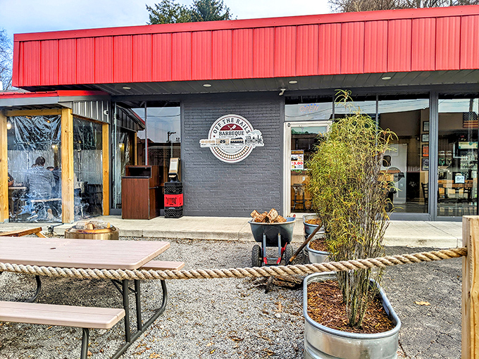 That red awning isn't just a design choice – it's a beacon calling hungry souls to smoky salvation.
