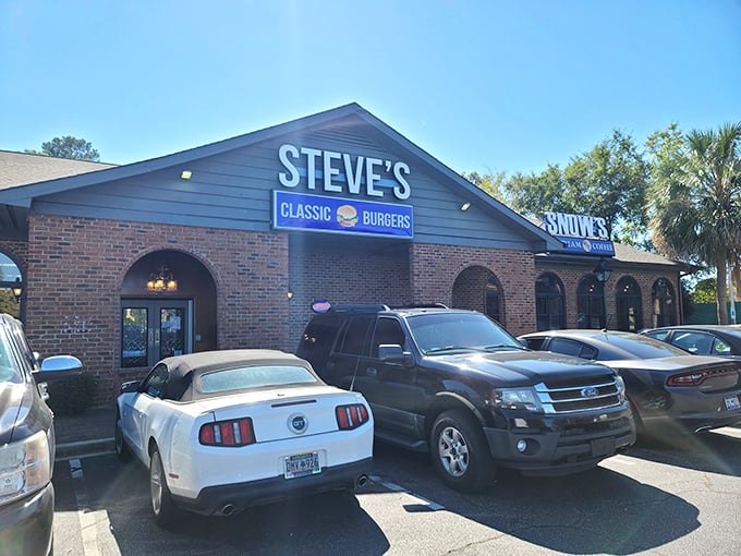 The unassuming brick exterior of Steve's Classic Burgers might not stop traffic, but the packed parking lot tells the real story. Burger paradise awaits inside.
