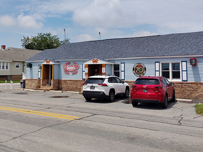 The iconic blue exterior with its bold red crab logo promises seafood treasures within – Delaware's ultimate "come as you are" dining destination.