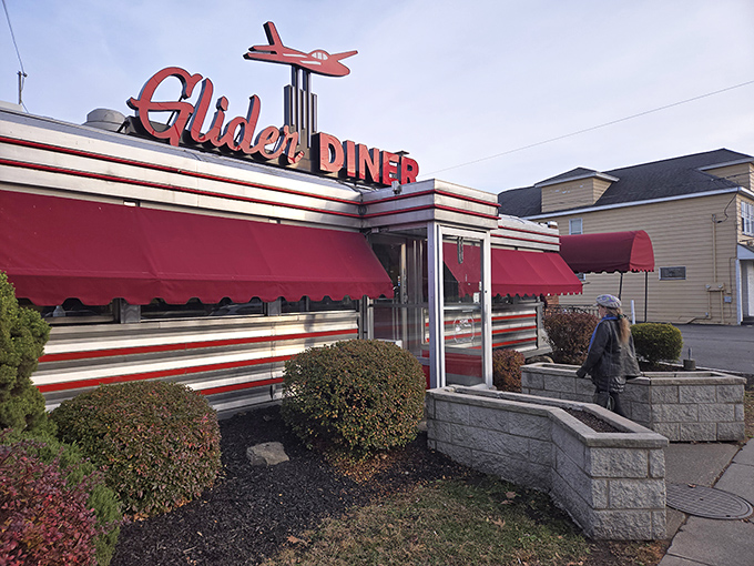 That iconic red glider airplane isn't just decoration—it's a beacon calling hungry travelers home to this Scranton institution where comfort food reigns supreme.