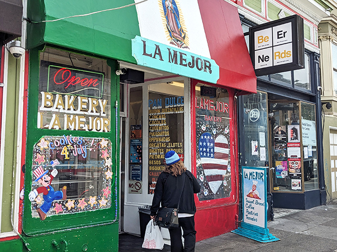 The vibrant red, white, and green façade of La Mejor Bakery stands as a colorful beacon of authentic Mexican pastries in San Francisco's Mission District.