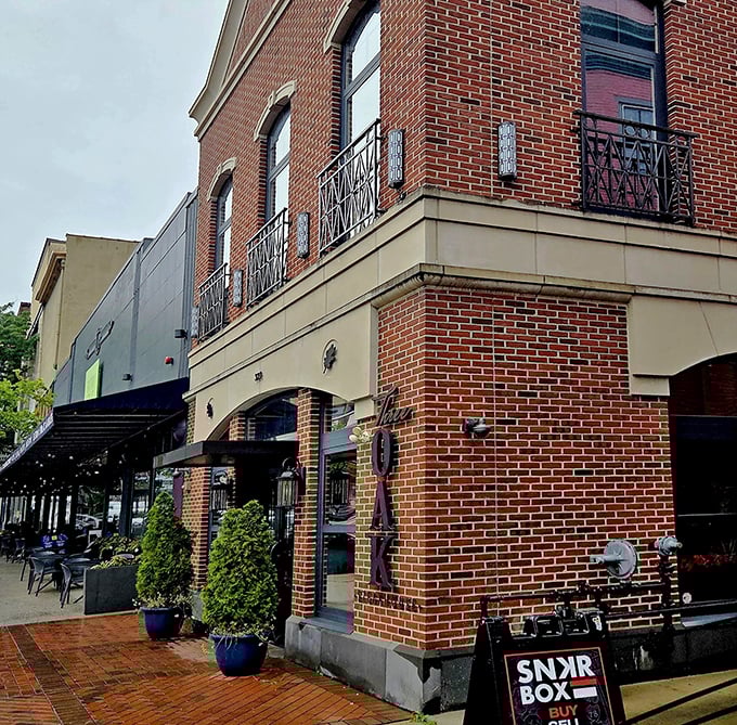 Three Oak Steakhouse stands proudly on its Easton corner, its classic brick façade promising culinary adventures within. The cobalt planters add just the right pop of color.