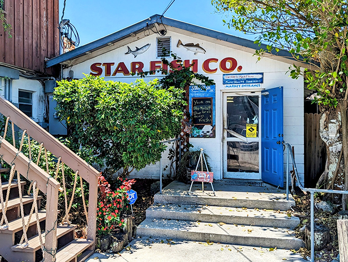 That bright blue door isn't just an entrance – it's your portal to Gulf Coast seafood paradise.