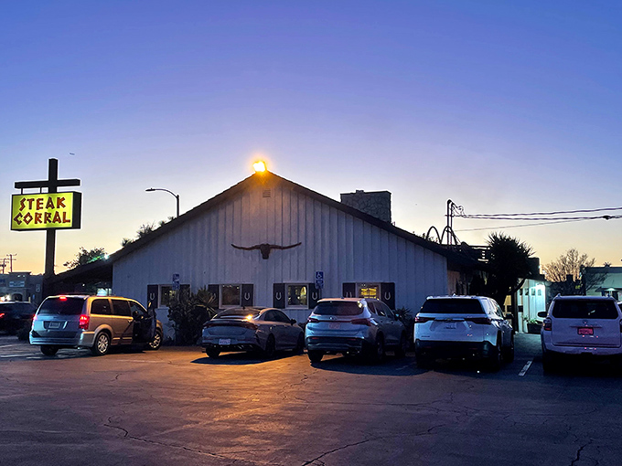 The iconic Steak Corral sign stands tall against the California sky, a beacon of hope for hungry carnivores seeking refuge from trendy food fads.