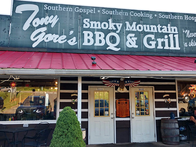 The flame-decorated signage isn't just for show—Tony Gore's red-roofed roadside haven delivers heat in both atmosphere and flavor.