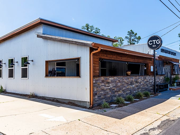 The rustic-meets-modern exterior of Copper Tap Grille beckons with its corrugated metal, warm wood, and stone accents—architectural proof that the best flavors often hide in unassuming packages.