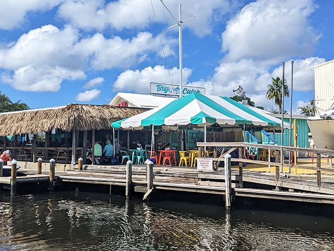 The turquoise facade of The Big Catch at Salt Creek isn't trying to hide – it's proudly announcing that Florida seafood paradise awaits inside.