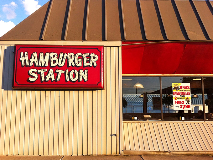 The iconic red sign beckons like a lighthouse for hungry travelers. Simplicity in architecture that promises complexity in flavor.