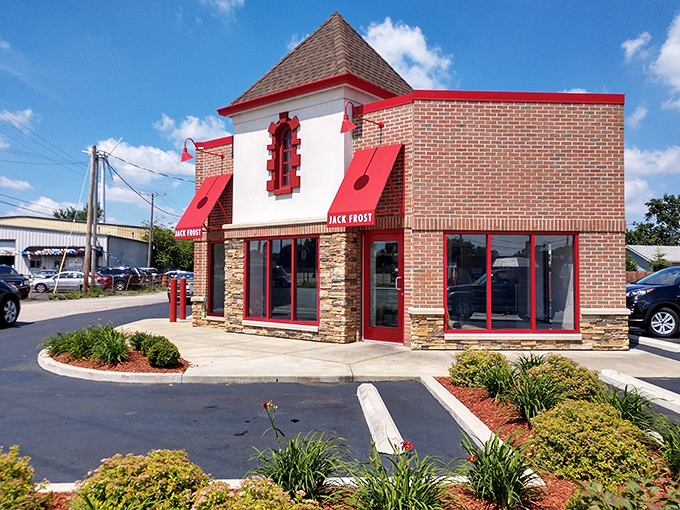 The white building with bold red signage stands like a beacon of sweetness on Pearl Road, promising "EVERY BATCH FRESH SCRATCH" – the donut lover's siren call.