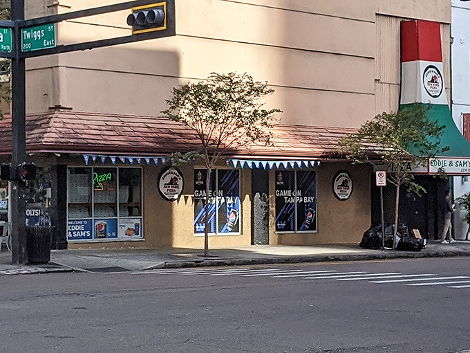 The unassuming corner spot where pizza dreams come true. Eddie and Sam's exterior might be modest, but inside awaits New York pizza perfection.