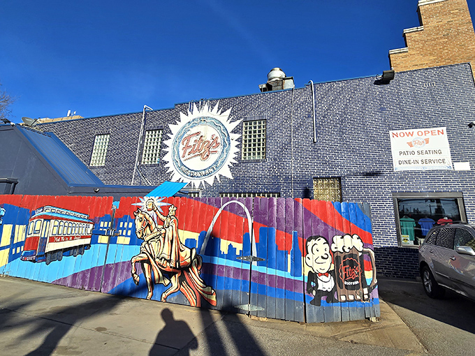 The blue brick fortress of fizz! Fitz's exterior mural tells the story of St. Louis in vibrant colors, with the iconic logo shining like a carbonated sun.