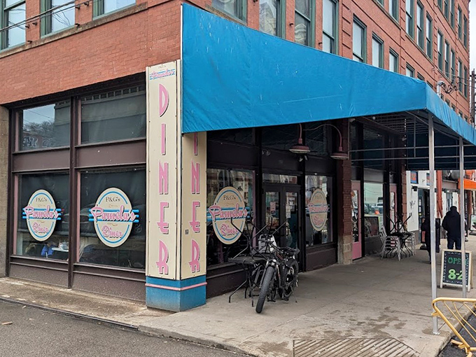 That turquoise awning isn't just a color choice – it's a beacon calling hungry souls to breakfast nirvana.
