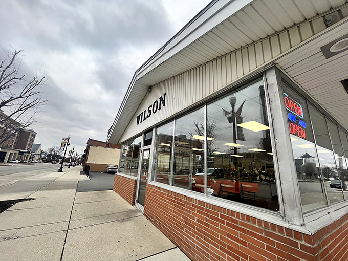 The unassuming white exterior of Wilson's Sandwich Shop stands as a beacon of culinary constancy in downtown Findlay, where flavor trumps flash every time.