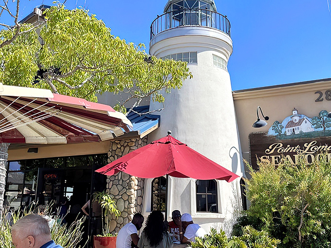 The lighthouse-inspired exterior of Point Loma Seafoods stands like a maritime beacon, guiding hungry souls to seafood nirvana in San Diego's harbor.