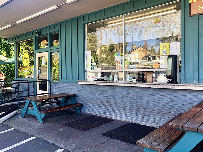Buttercup's turquoise exterior isn't just a building—it's an invitation. Those picnic tables have witnessed more food epiphanies than a cooking show marathon.