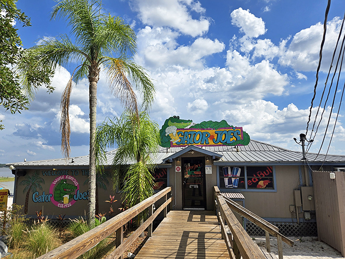 The iconic Gator Joe's entrance beckons with its wooden boardwalk and palm trees—Florida's version of a yellow brick road to seafood paradise.