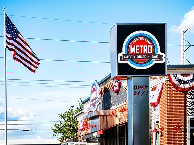 The iconic red and white exterior of Metro Cafe Diner stands like a beacon of comfort food against Stone Mountain's blue sky.