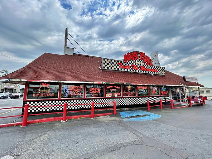 The classic red roof and checkered facade of Nifty Fifty's isn't just a restaurant—it's a time machine disguised as a diner on Grant Avenue.