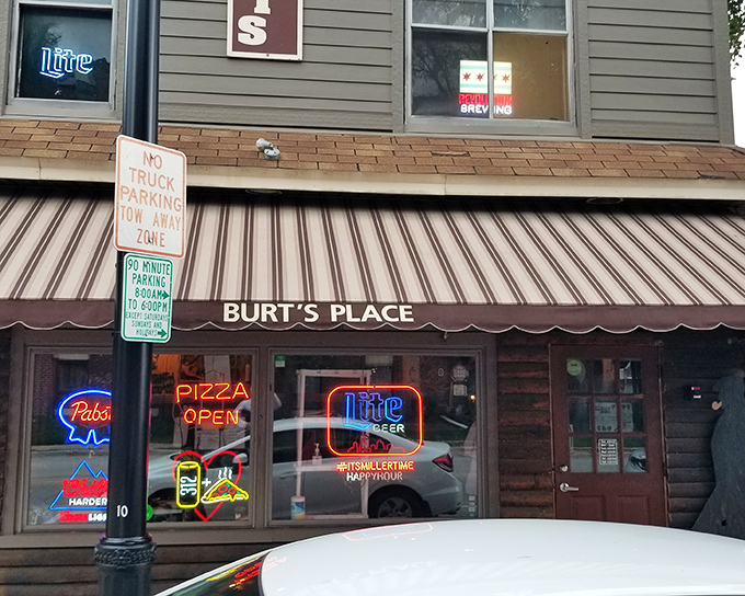 The unassuming brick exterior of Burt's Place hides pizza greatness like Clark Kent's glasses hide Superman. That neon "PIZZA OPEN" sign is your beacon to bliss.