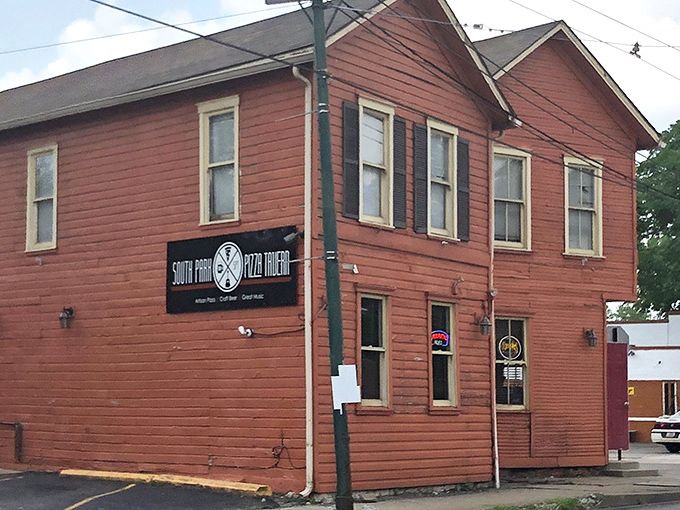 The fire-engine red exterior of South Park Pizza Tavern stands out like a culinary lighthouse, beckoning hungry travelers to dock for delicious discoveries.
