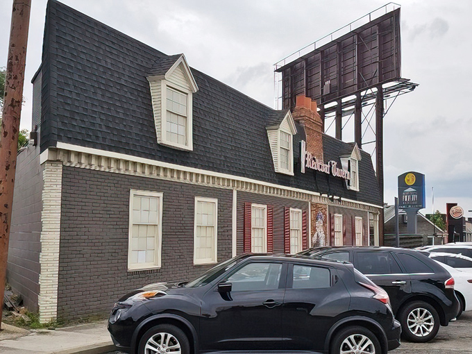 Colonial charm meets Midwest hospitality at Redcoat Tavern's distinctive exterior. That red door isn't just an entrance—it's a portal to culinary bliss.