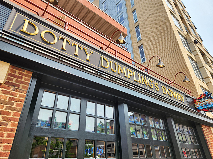 The golden lettering of Dotty Dumpling's Dowry gleams against brick and glass, like a treasure chest waiting to be discovered in downtown Madison.