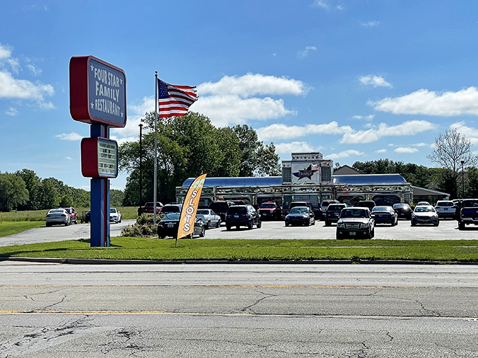 The patriotic facade of Four Star Family Restaurant gleams like a beacon for hungry travelers, promising all-American comfort in the heart of Mt. Zion.