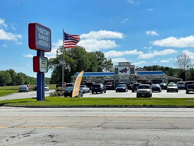 The patriotic facade of Four Star Family Restaurant gleams like a beacon for hungry travelers, promising all-American comfort in the heart of Mt. Zion.