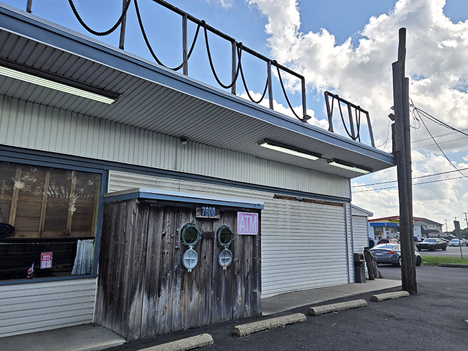 The unassuming exterior of Under the Pier looks like a movie set where seafood dreams and nautical nostalgia collide—complete with those charming porthole windows.