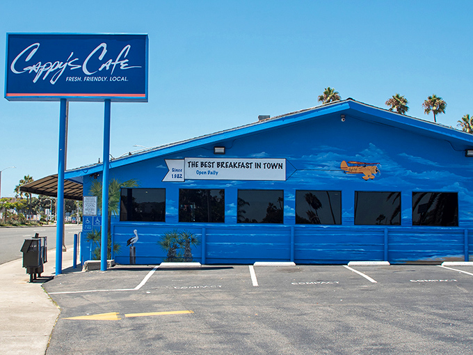 The bright blue beacon of breakfast bliss stands proudly along PCH, promising "the best breakfast in town" – a bold claim that generations of Newport locals will happily defend.