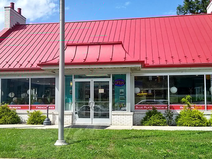 That iconic red roof signals you've arrived at breakfast paradise. The white brick building with its classic "OPEN DAILY" sign promises comfort food magic awaits inside.