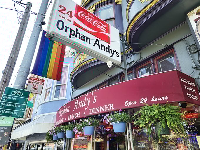 The Castro's 24-hour beacon of breakfast bliss beckons with its vintage Coca-Cola sign and cheerful planters—a neon-lit promise of comfort food at any hour.