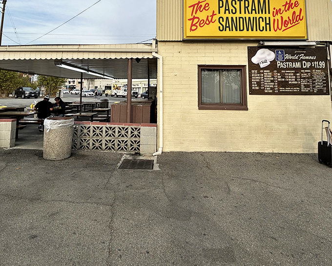 The yellow sign doesn't lie—this unassuming building houses pastrami dreams that have kept Californians coming back for generations.