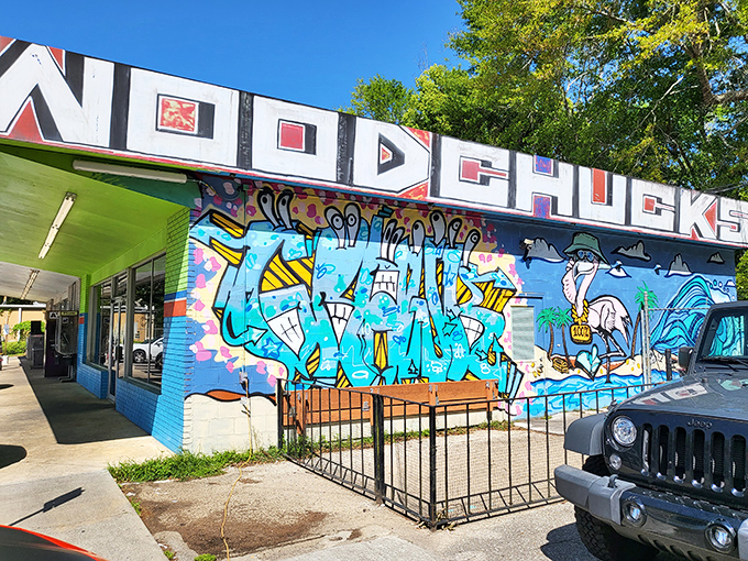 That vibrant mural outside Woodchuck's practically shouts "Come on in!" – and trust me, you'll want to listen.