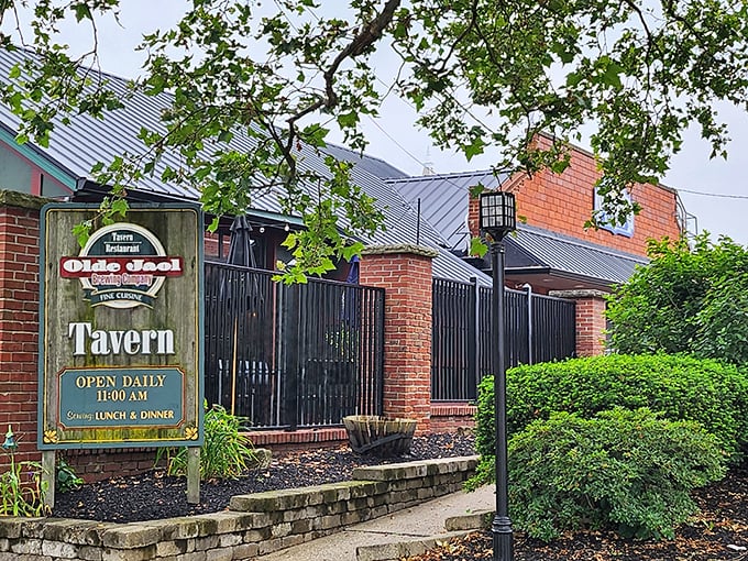 The historic brick exterior of Olde Jaol welcomes you with its weathered sign—proof that some of the best culinary experiences come with a side of character.