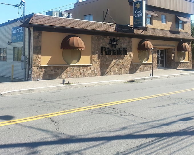 The stone facade of Cafe Rinaldi stands like a culinary fortress in Old Forge, promising Italian treasures within that rival any nonna's kitchen. 
