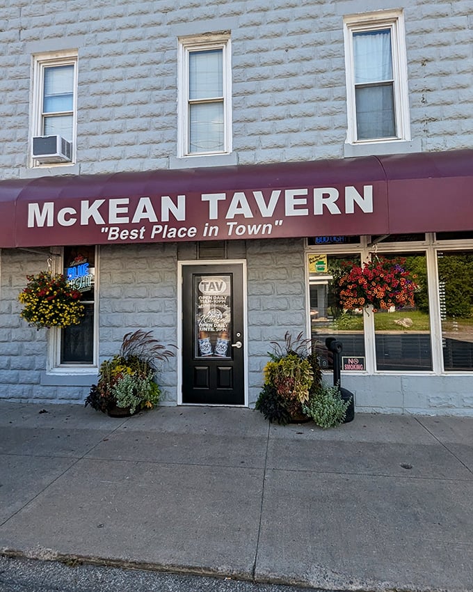The unassuming stone facade of McKean Tavern promises little but delivers big. Those hanging flower baskets aren't just for show—they're your first clue this place cares about details. 