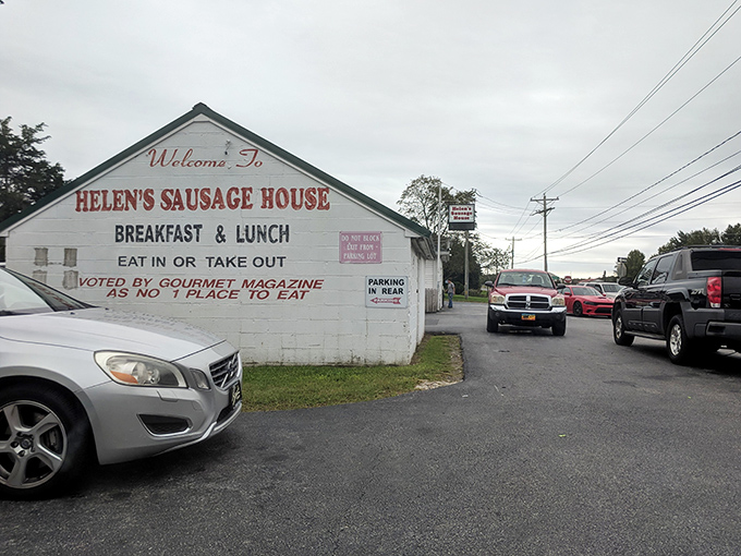The unassuming white exterior of Helen's Famous Sausage House—proof that culinary greatness doesn't need fancy architecture, just perfect sausage.