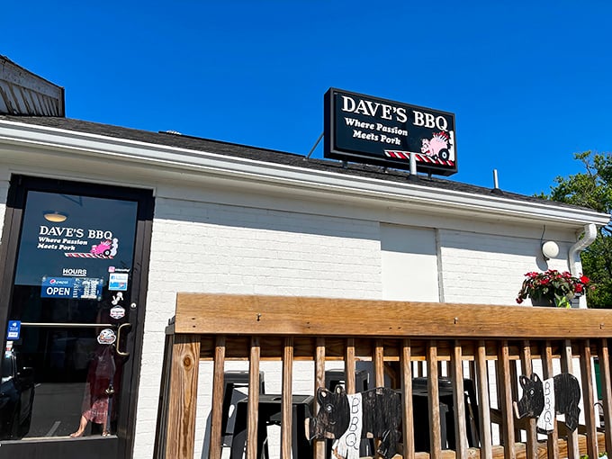 The unassuming white brick exterior of Dave's BBQ hides a smoky paradise within. That sign isn't kidding about passion meeting pork!