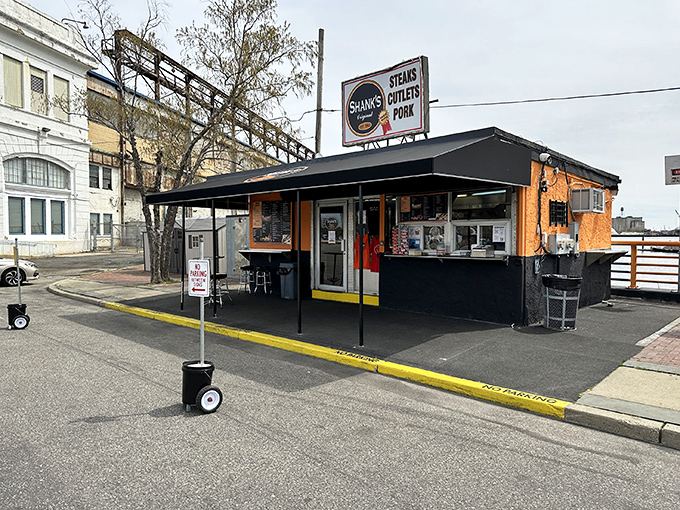 The unassuming exterior of Shank's Original stands like a culinary lighthouse on Pier 40, beckoning sandwich pilgrims with its simple promise: "STEAKS CUTLETS PORK."