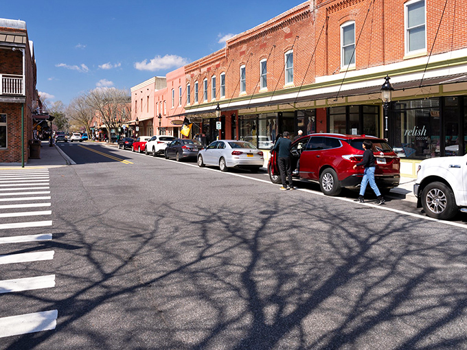 Main Street magic at its finest. These historic brick storefronts aren't just preserved—they're alive with shops that would make Norman Rockwell reach for his paintbrush.