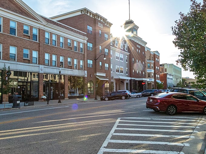 Downtown Beloit's historic architecture stands proudly along Pleasant Street, where brick buildings house local businesses beneath a perfect Midwestern sky.