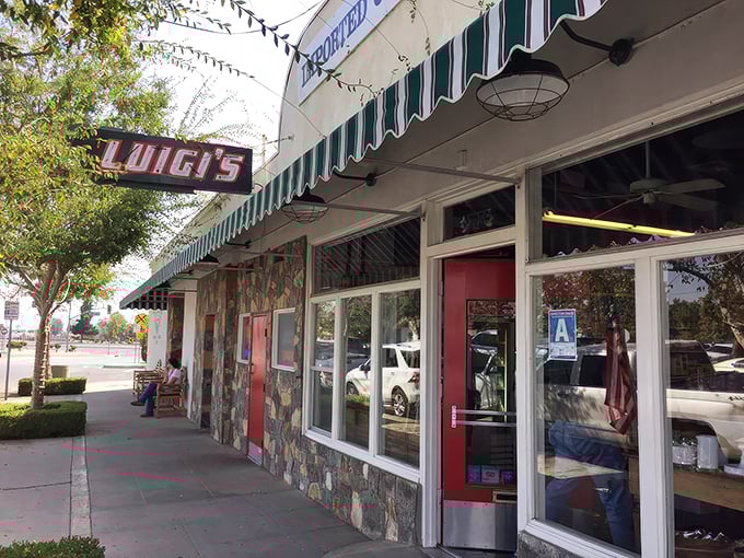 Luigi's classic storefront beckons with its vintage sign and green-striped awning—a time capsule of Italian-American tradition standing proudly in Bakersfield.
