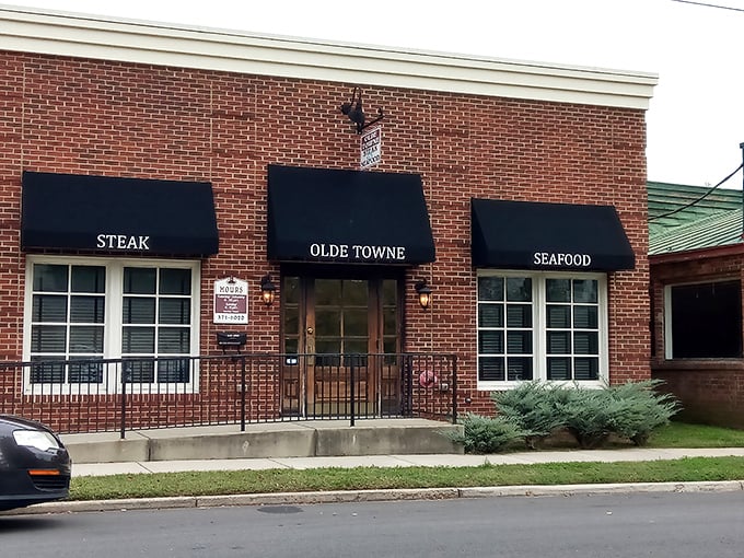 Three simple black awnings tell you everything you need to know: STEAK, OLDE TOWNE, SEAFOOD. No gimmicks, just promises they fully intend to keep.